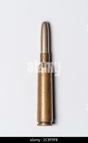 Old rifle bullet from the 1950s on white background Stock Photo - Alamy
