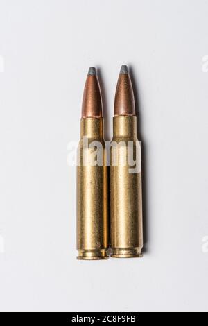 Rifle bullets on white background Stock Photo - Alamy