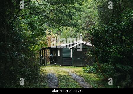 A secluded bush hut in the West Coast of the South Island, New Zealand ...