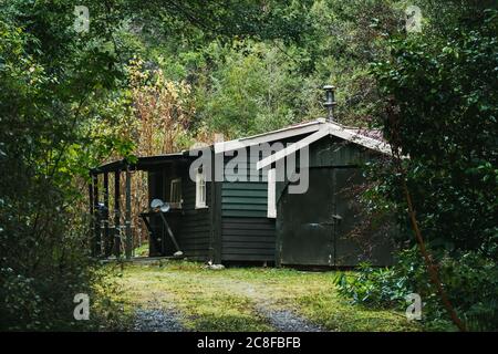 A secluded bush hut in the West Coast of the South Island, New Zealand ...