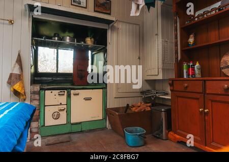Interior of a small restored bush hut in New Zealand. A classic wood ...
