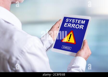 Tablet screen displaying a system error concept Stock Photo - Alamy