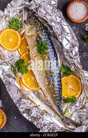 raw mackerel with spices in baking foil, top view Stock Photo - Alamy