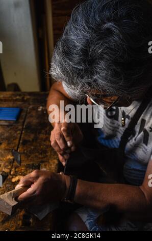 Violin maker luthier Carlos Roberts in his Cremona Italy workshop ...