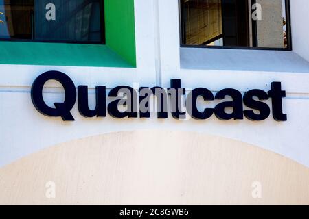 Close-up of Quantcast logo on office building facade with arched ...