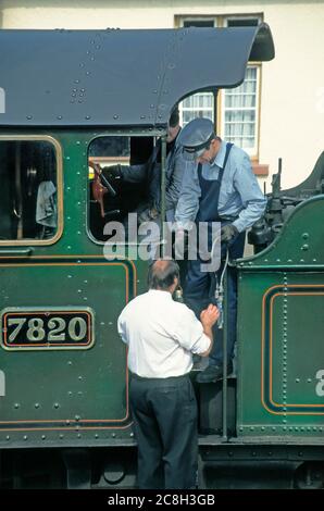 Railway engine driver in historical uniform Stock Photo - Alamy
