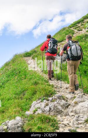 Hikers follow a foot path on Dun I, Isle of Iona, Scotland Stock Photo ...