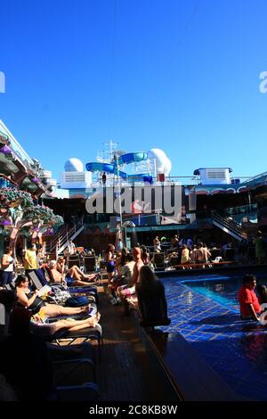 Sun deck, pool and sea screen on P & O cruise ship Azura, cruising in ...