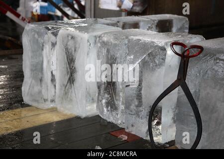 A large melting ice block cube on fire Stock Photo - Alamy
