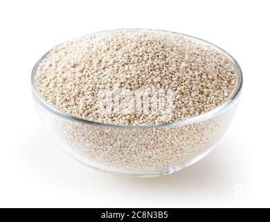 Glass bowl with raw quinoa seeds on white surface. Healthy and ...