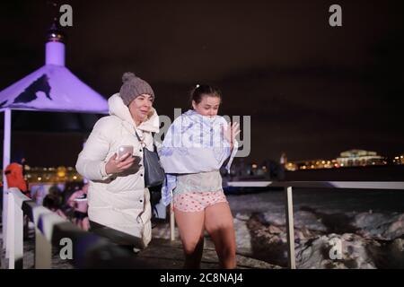 Russian women going from ice bath during celebrating Epiphany in Saint ...