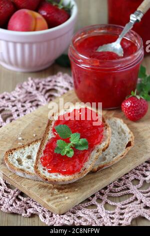 Strawberry fruit and jam on a wooden table top view Stock Photo - Alamy