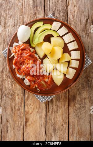 Bermuda codfish breakfast with onion tomato sauce, boiled potatoes ...