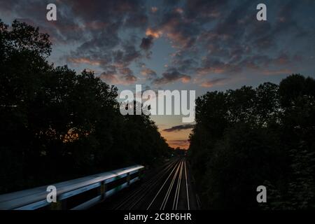 Trains head towards Brighton from Victoria under a lovely sunset Stock ...