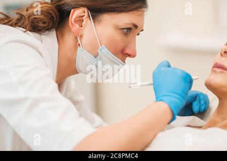 Plastic surgeon doctor injects Botox into the egg concept of injections ...