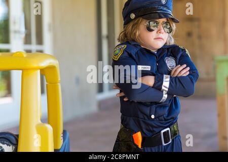 Boy age 6 boy pretending to be a police officer Stock Photo - Alamy