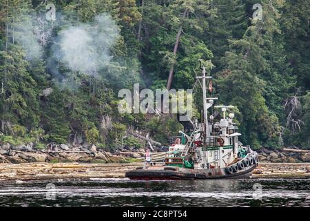 Tug Boat pushing log boom down the Fraser River, bordering Vancouver ...