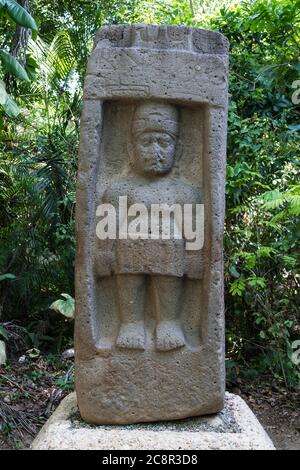Olmec sculpture carved from stone. Big stone head statue in a jungle ...