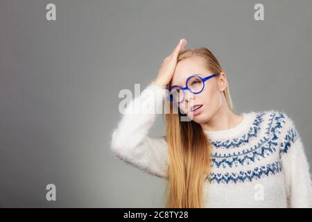 Face expressions, disregard, stupid behavior concept. Nerd blonde woman ...