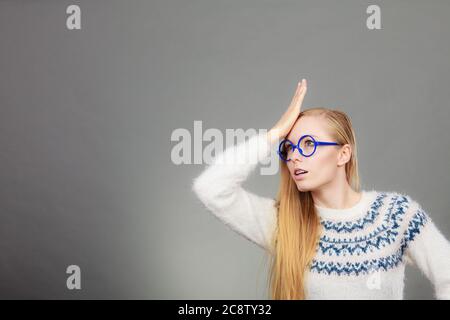 Face expressions, disregard, stupid behavior concept. Nerd blonde woman ...