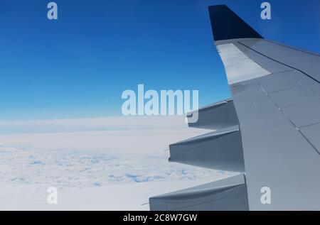 Wing aircraft in altitude during flight Stock Photo - Alamy