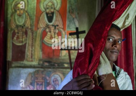 Debre Sina Beta Maryam church, Lake Tana, Bahir Dar, Ethiopia. A priest ...