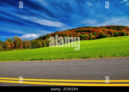 Road across New England countryside in foliage season, USA Stock Photo ...