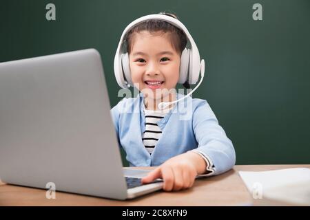 Primary school girls online learning Stock Photo - Alamy