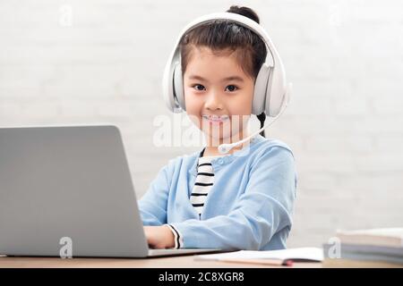 Primary school girls online learning Stock Photo - Alamy