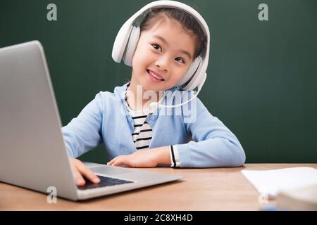 Primary school girls online learning Stock Photo - Alamy