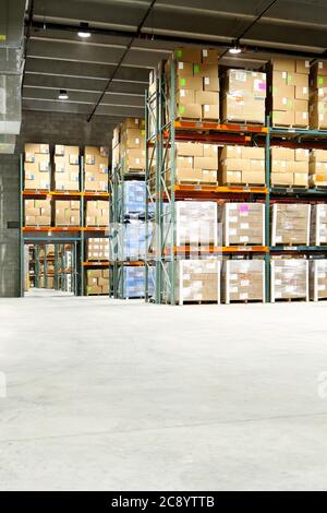 Big warehouse storage room with boxes and shelves Stock Photo - Alamy