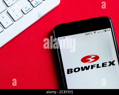 In this photo illustration a Bowflex logo is seen displayed on a ...