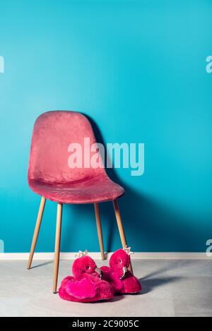 Modern Pink Velour Chair on wooden legs, blue background Stock Photo ...