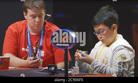 THE SPEED CUBERS, a young speedsolver (with cube) at a Rubik s Cube ...