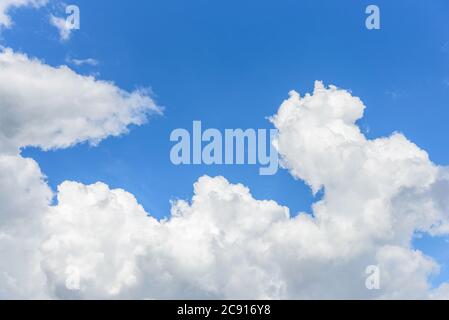 white clouds disappear in the hot sun on blue sky. Time-lapse motion ...