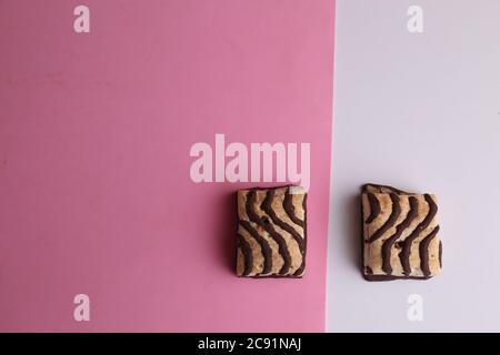 Two brown and pink cakes isolated on white background Stock Photo - Alamy