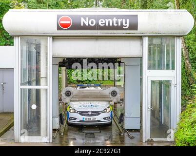 A Police patrol car being cleaned in an automatic car wash Stock Photo ...