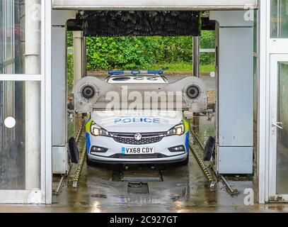 A Police patrol car being cleaned in an automatic car wash Stock Photo ...