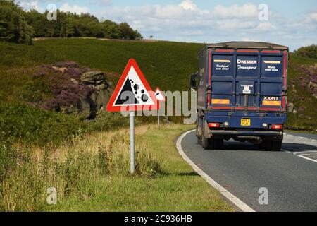 Falling rocks and tight bends chevrons on a rural A-road in North ...