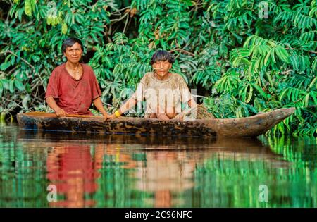 INDIOS YANOMAMI, IRONAVI TRIBE, CANOEING ON BRAZO CASIQUIAIRE, AMAZONAS ...