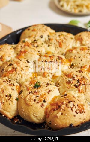 Freshly-made delicious cheese bubble pizza bread with ingredients and ...