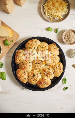 Freshly-made delicious cheese bubble pizza bread with ingredients and ...