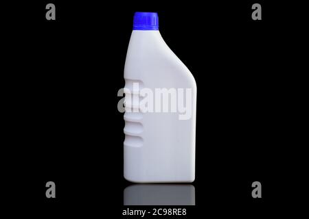 Engine oil bottle on black background, close up Stock Photo - Alamy