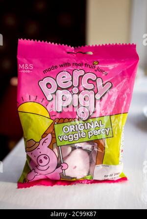 Bag of Marks & Spencer percy pig fruity chews sweets opened with contents spilled spilt set on ...