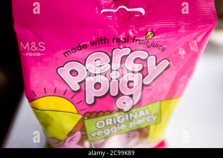 Bag of Marks & Spencer percy pig fruity chews sweets opened with contents spilled spilt set on ...