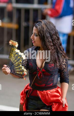 Members of a Waca Waca dance group in ornate costume parade through the ...