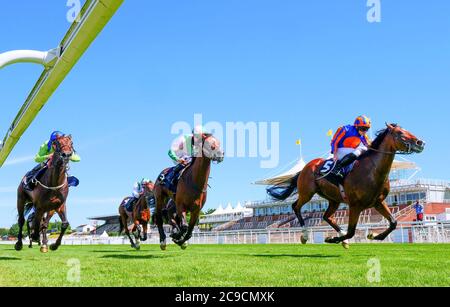 Mogul ridden by jockey Ryan Moore (right) on their way to win the John ...