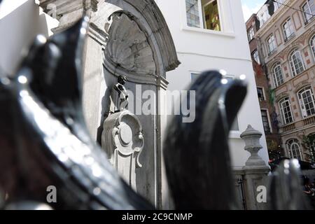 The famous Manneken Pis (Peeing Boy) landmark in Brussels, Belgium ...