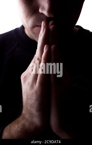 Man's hand together, prayer and request - silhouette, isolate Stock ...