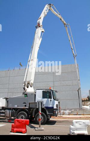 Construction concrete pump (pump truck) on the background construction ...